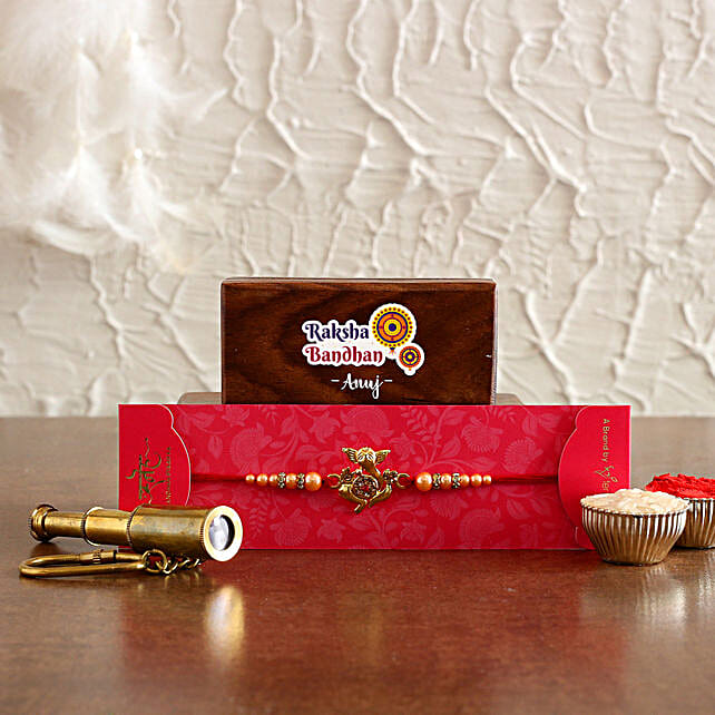 Ganesha Rakhi and Personalised Telescope Keychain Combo bahrain | Gift ...