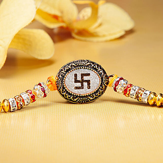 Buy/Send Antique Swastik Rakhi Online- FNP