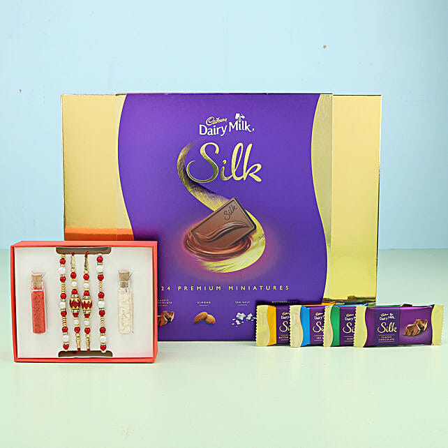 Buy/Send Cadbury Silk Premium With Pearl Rakhis Combo Online- FNP