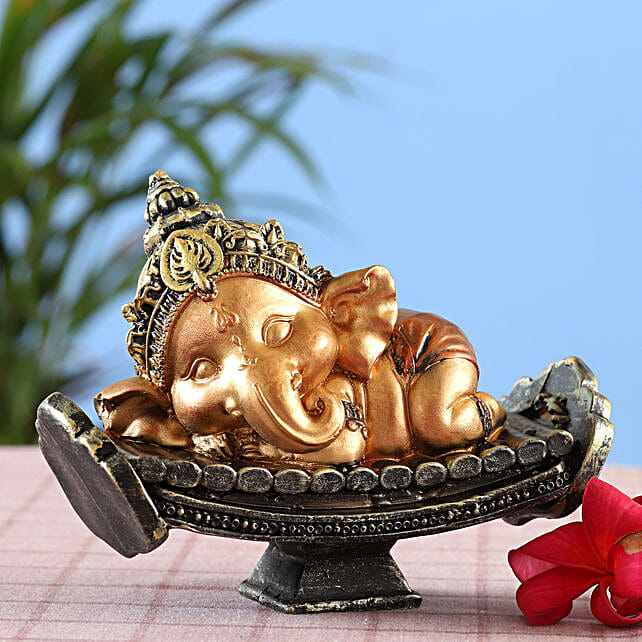 Buy/Send Rich Golden Resting Bal Ganesha Idol Online- FNP