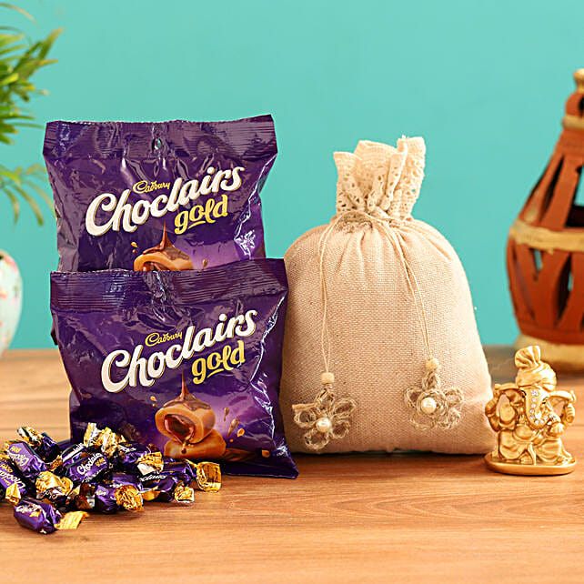 Buy/Send Golden Ganesha Idol & Choclairs In Fancy Potli Online- FNP
