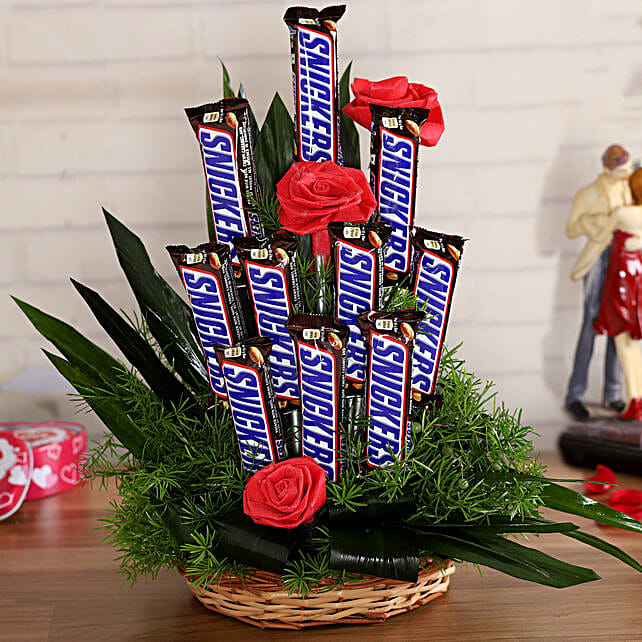 Buy/Send Snickers & Artificial Red Flowers Arrangement Online- FNP