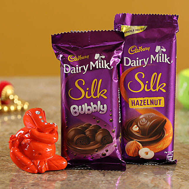 Buy/Send Dairy Milk Silk Hazelnut Bubbly Combo & Orange Ganesha Idol ...