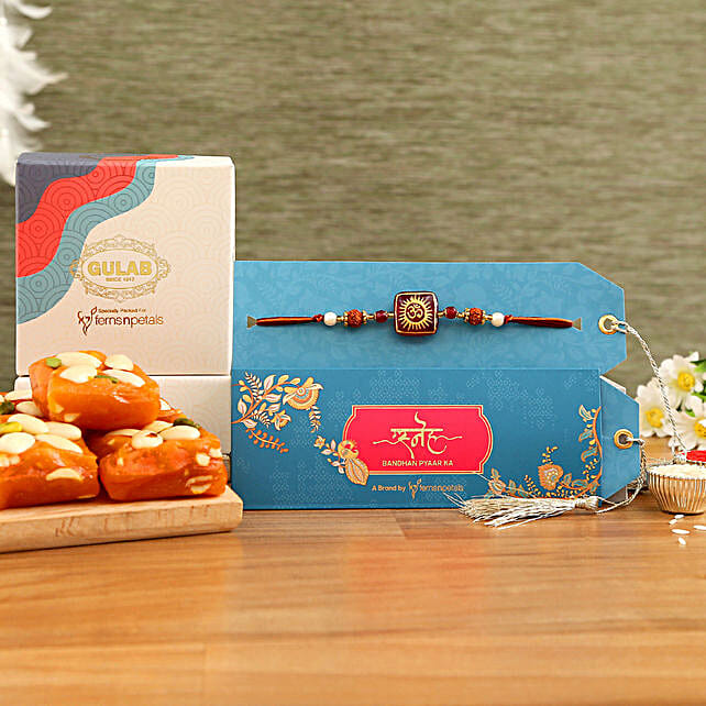 Buy/Send Om Designer Rakhi & Karachi Halwa Box Online- FNP