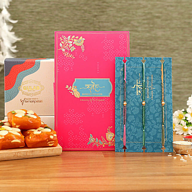 Buy/Send Lovely Pearl Set of 3 Rakhi & Karachi Halwa Box Online- FNP