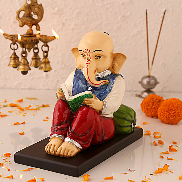Buy/Send Multicoloured Reading Ganesha Idol Online- FNP