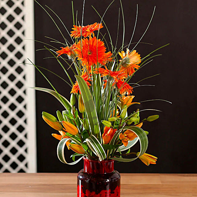 Buy/Send Exotic Orange Flowers Arrangement Online- FNP