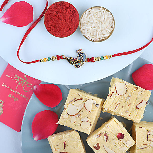 Buy/Send Sneh Meenakari Peacock Rakhi with Soan Papdi Online- FNP
