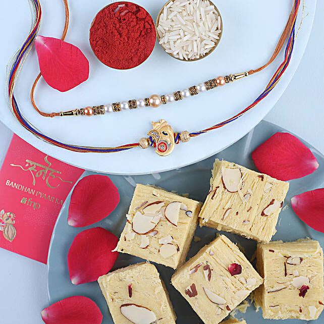Buy/Send Sneh Pearl & Ganesha Rakhi With Soan Papdi Online- FNP