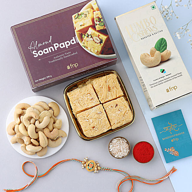 Buy/Send Sneh Ganesha Rakhi - Nuts and Soan Papdi Combo Online- FNP