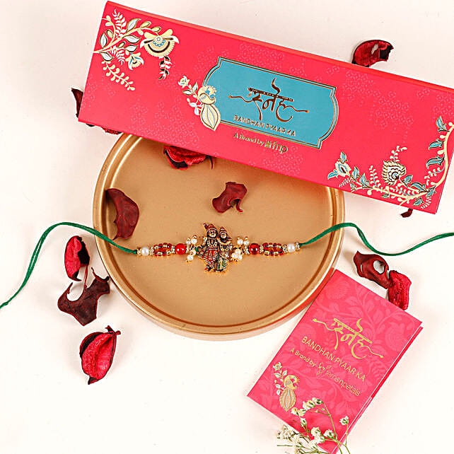 Buy/Send Spectrum Pearl Radha Krishna Rakhi Online- FNP