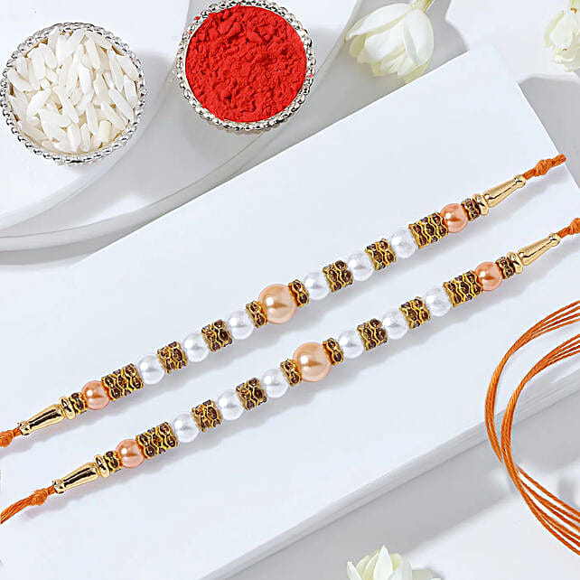 Buy/Send Ethereal Om Swastik Pair Rakhi Online- FNP