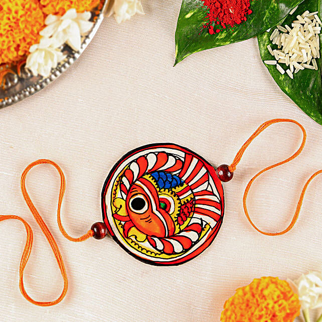 Buy/Send Tholpavakoothu Ritualistic Art Rakhi Online- FNP