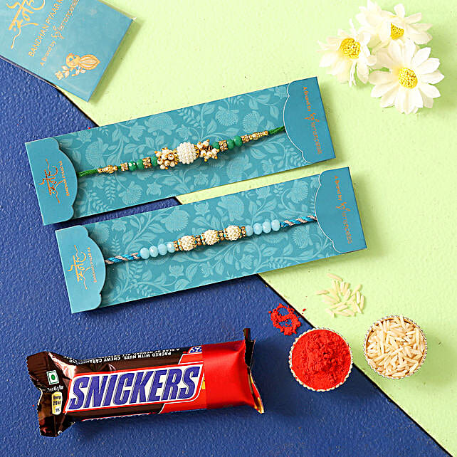 Green & Sea Blue Pearl Rakhis With Snickers qatar | Gift Green & Sea ...