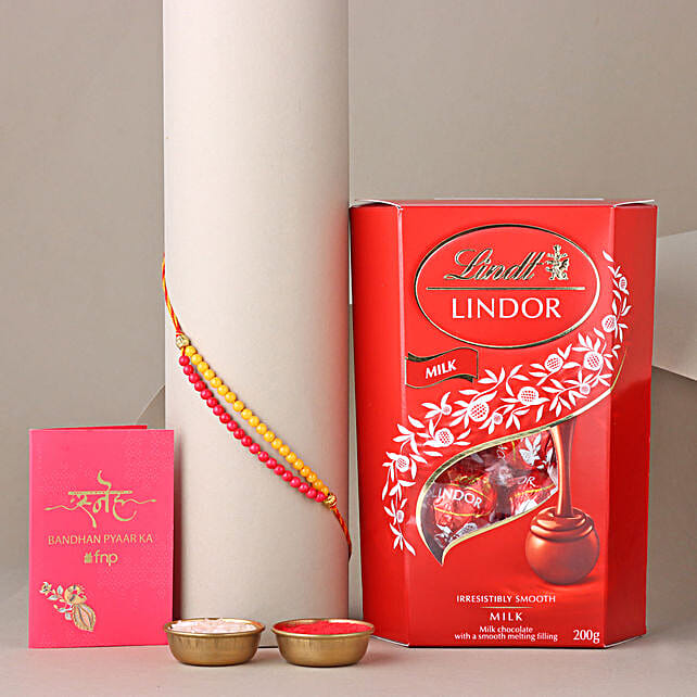 Sneh Red and Yellow Bead Rakhi with Lindt Lindor Chocolate Box ...