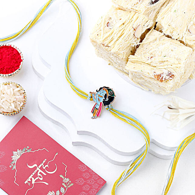 Melodic Krishna Rakhi For Kids & Delectable Soan Papdi Gift Set ...