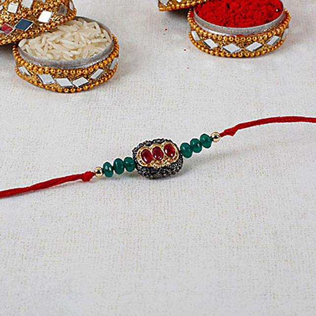 Dashing Red Stone Rakhi uae | Gift Dashing Red Stone Rakhi- FNP