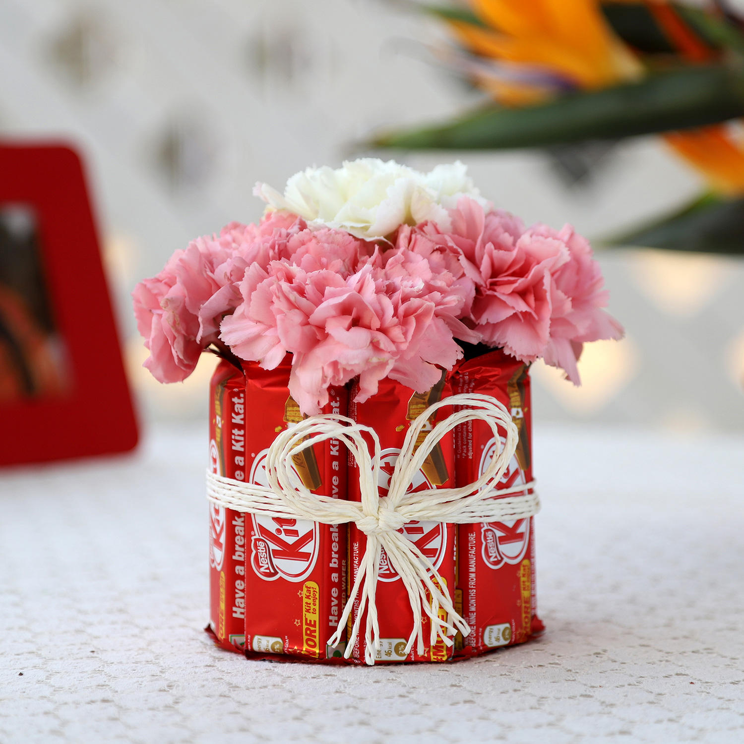 Buy/Send Carnations & Kit Kat Glass Arrangement Online- Ferns N Petals