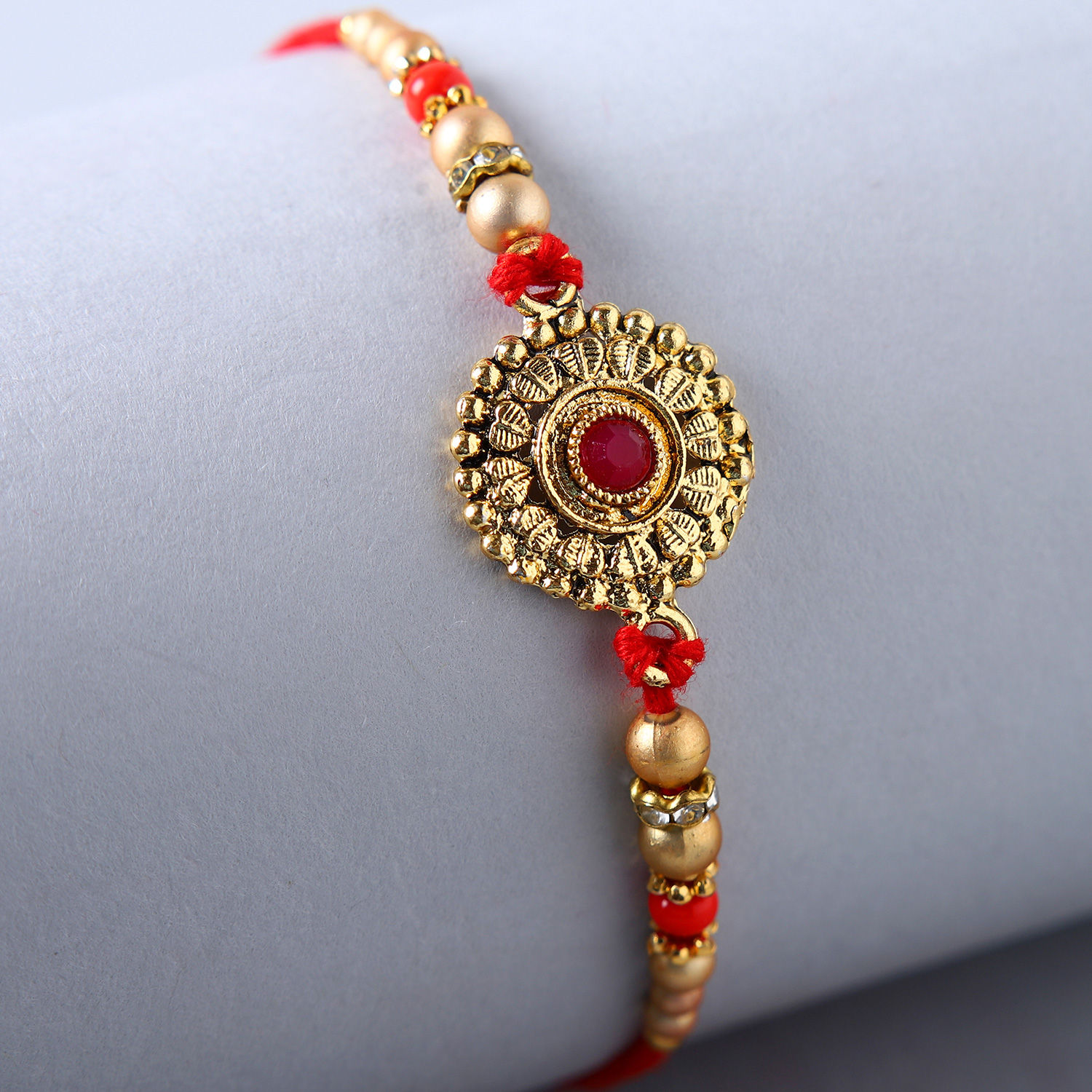 Buy/Send Traditional Kundan Rakhi and Sweet Savoury Treats Online ...